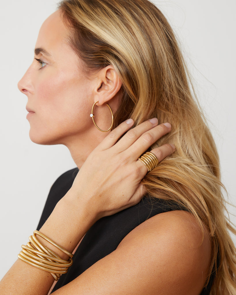 Yellow gold tubo ring seven times around